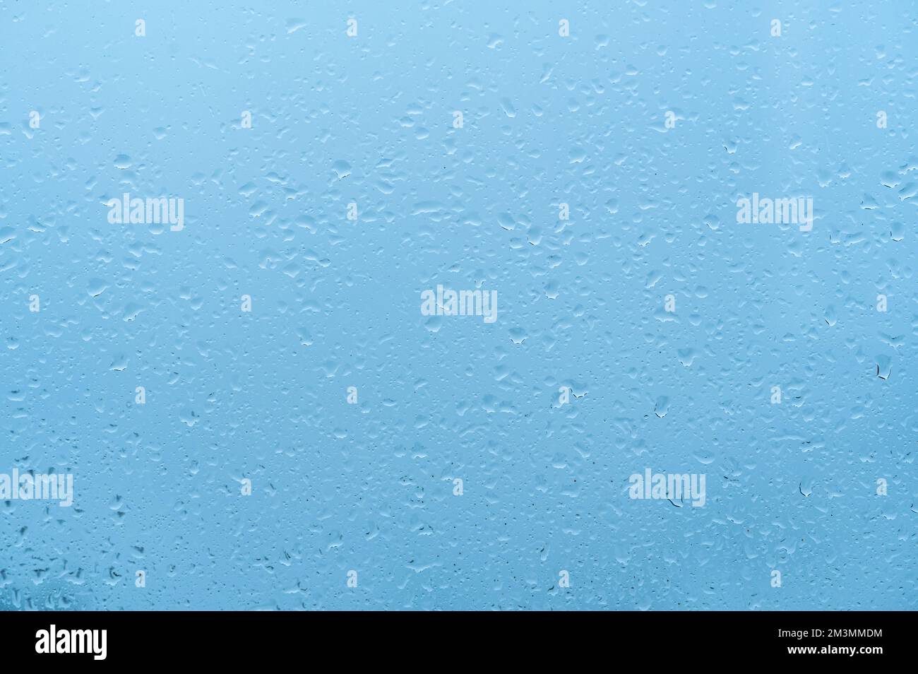 Water Drops Background. Rain drops on window on blue sky, blue ... Water Drops Background. Rain drops on window on blue sky, blue ...
