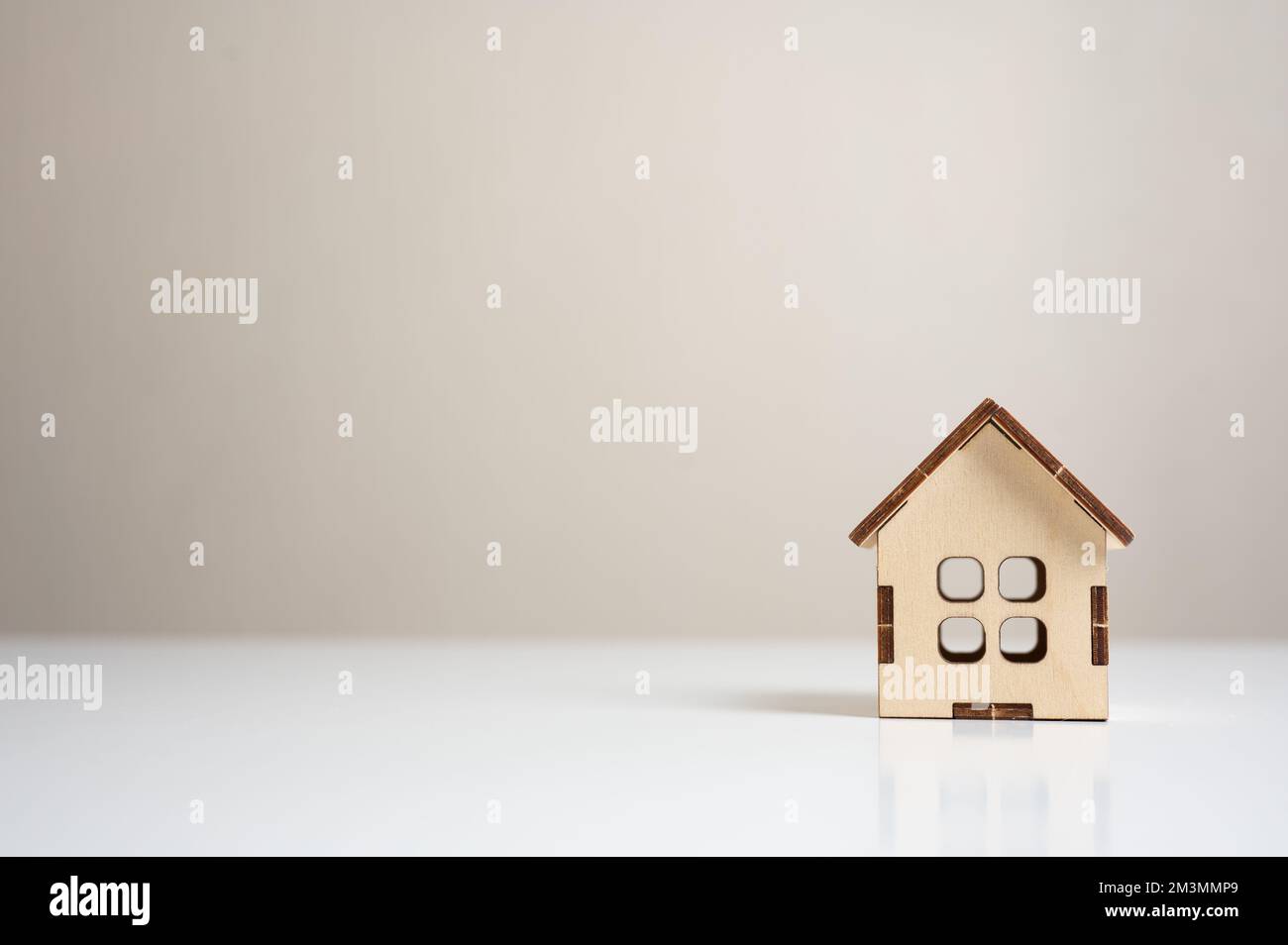 wooden house model on white table. Housing and Real Estate concept ...
