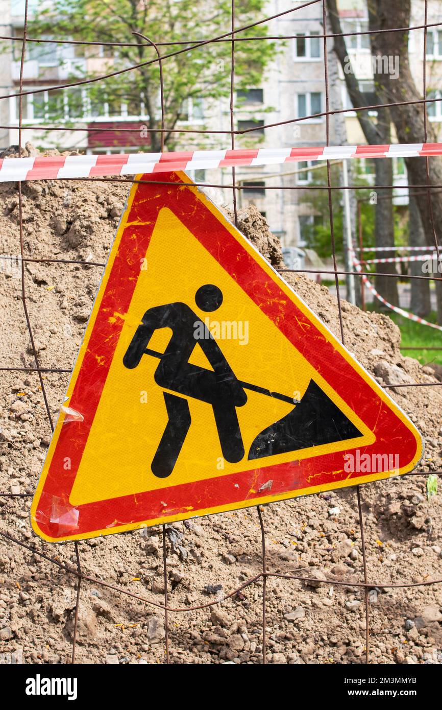 Roadworks, under construction. Earthwork sign on fence close up Stock ...