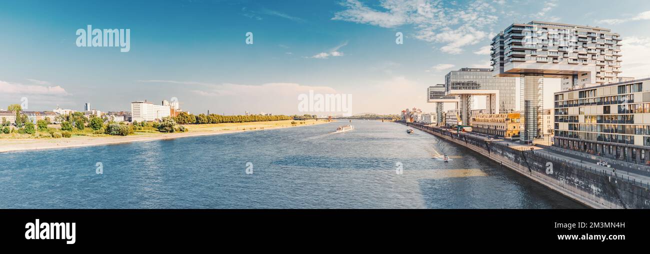 Wide panoramic view of a Cologne cityscape skyline with Rhine river and ...