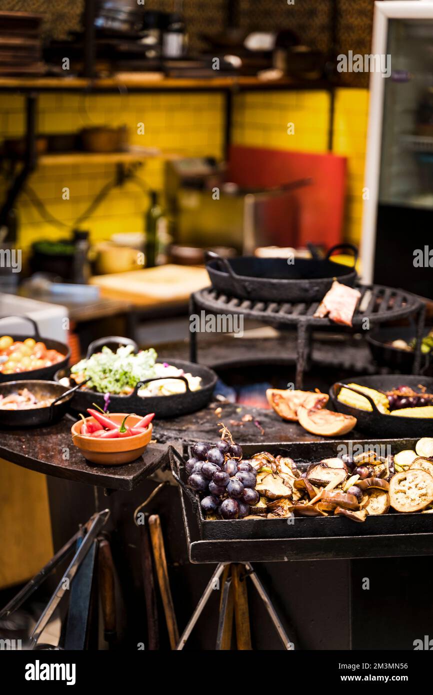 Grilled food and vegetables in the restaurant kitchen ready to eat ...