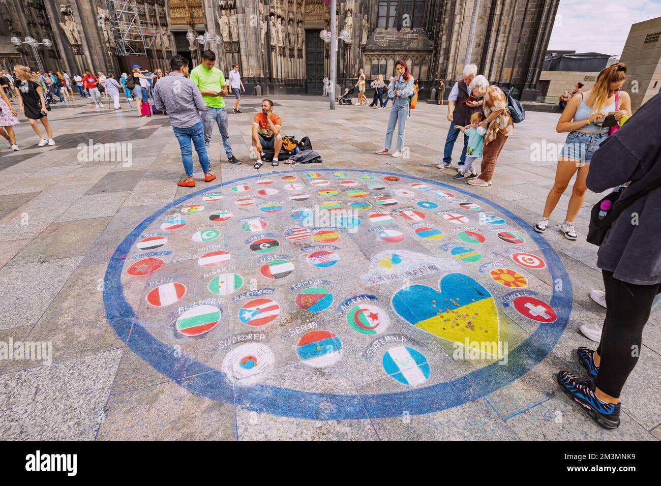 31 July 2022, Koln, Germany: Street artist make painting with donation ...