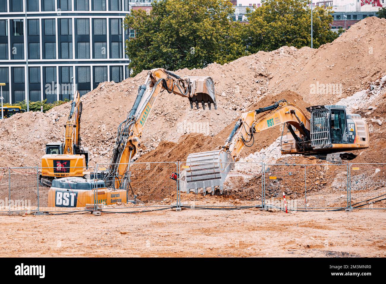 27 July 2022, Essen, Germany: Three excavators are working on a ...