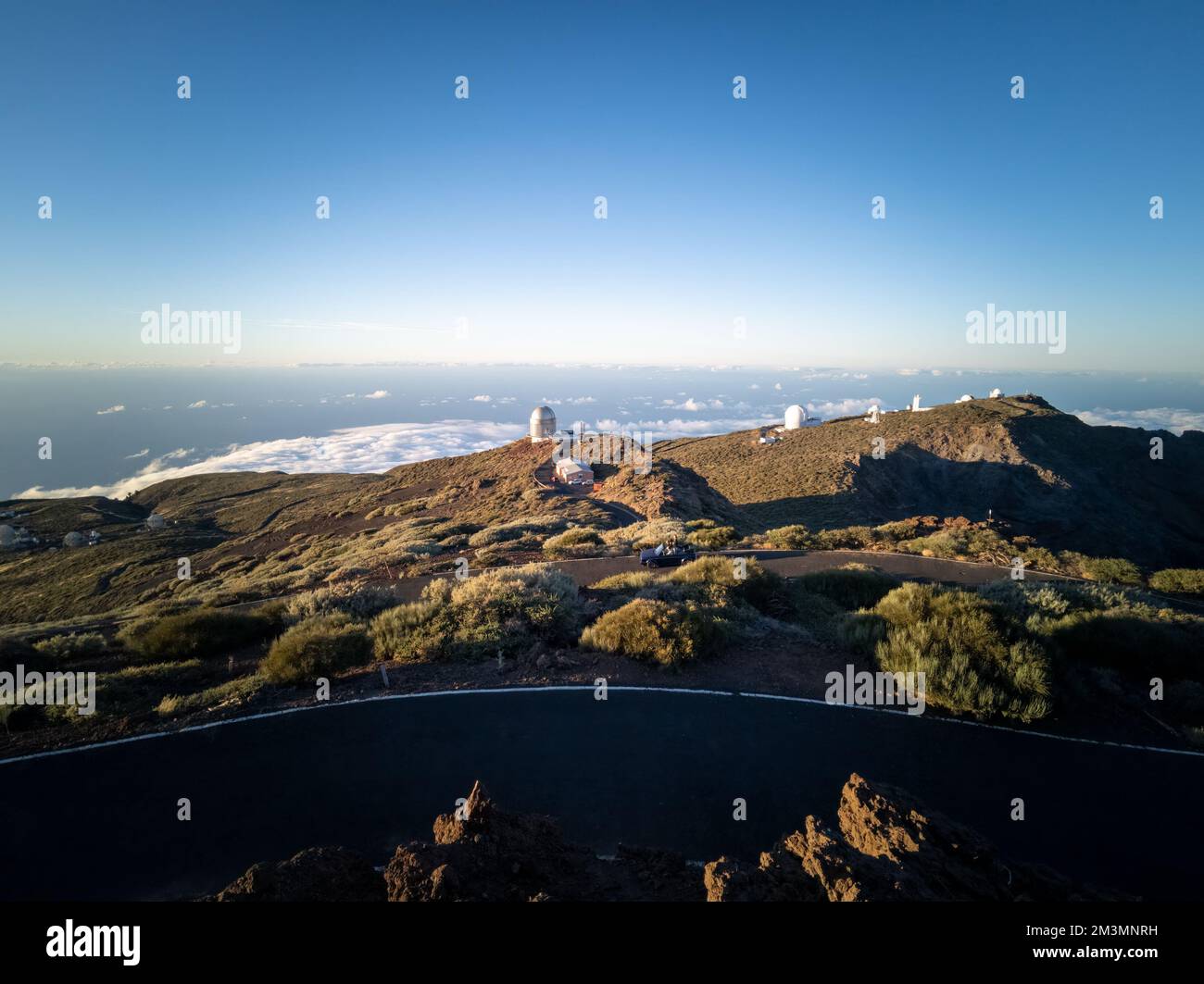 Convertible car driving over Roque de los Muchachos road Stock Photo ...