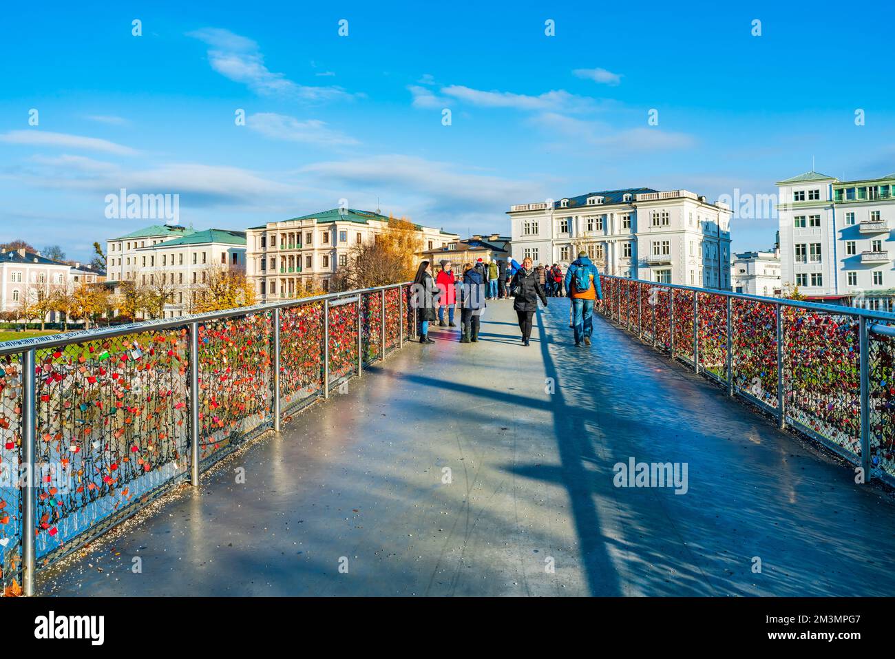 SALZBURG, AUSTIRA - DECEMBER 06, 2022: Tourists walk on the Makartsteg ...
