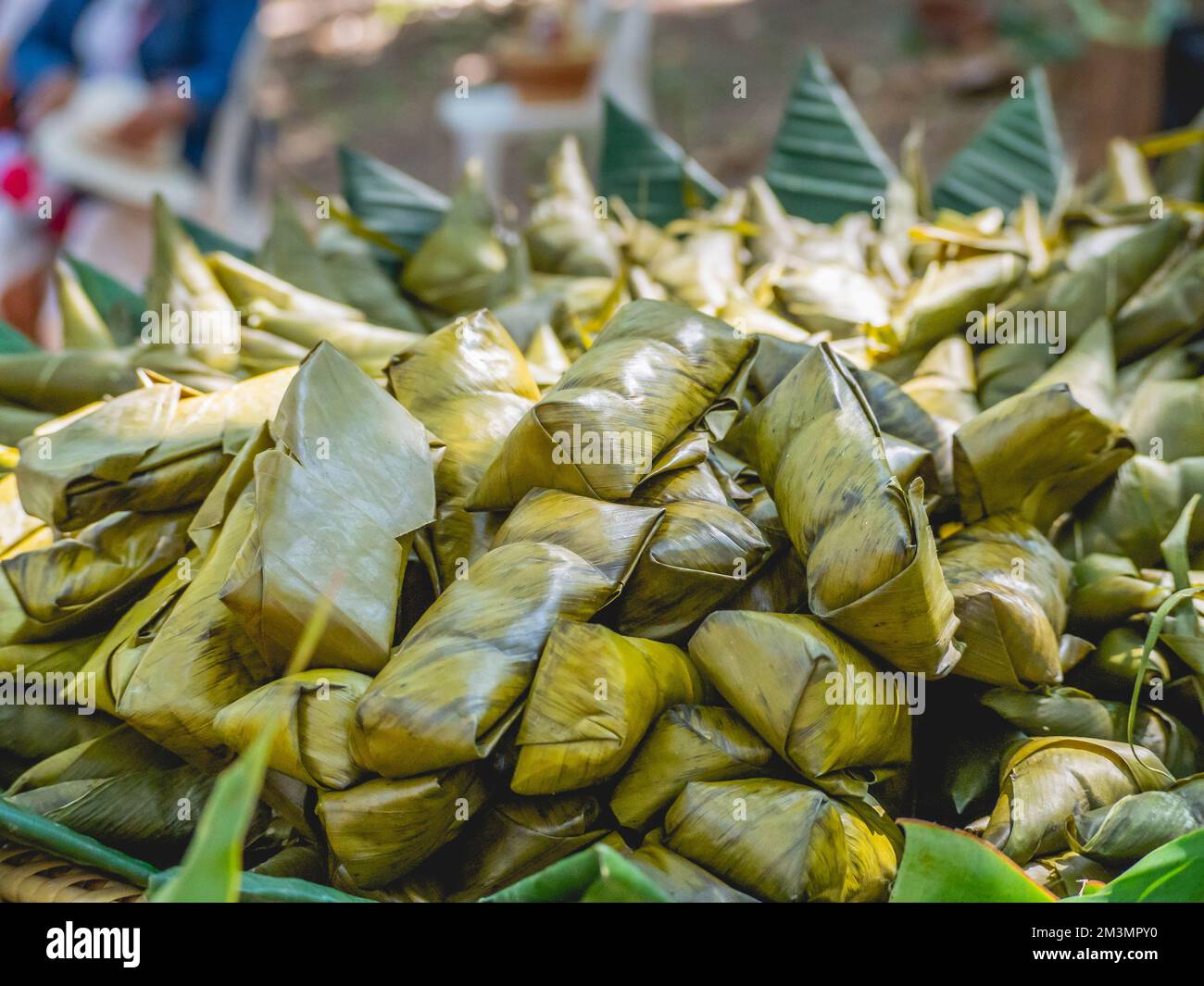 Thai boiled dessert wrapped in banana leaves Stock Photo - Alamy