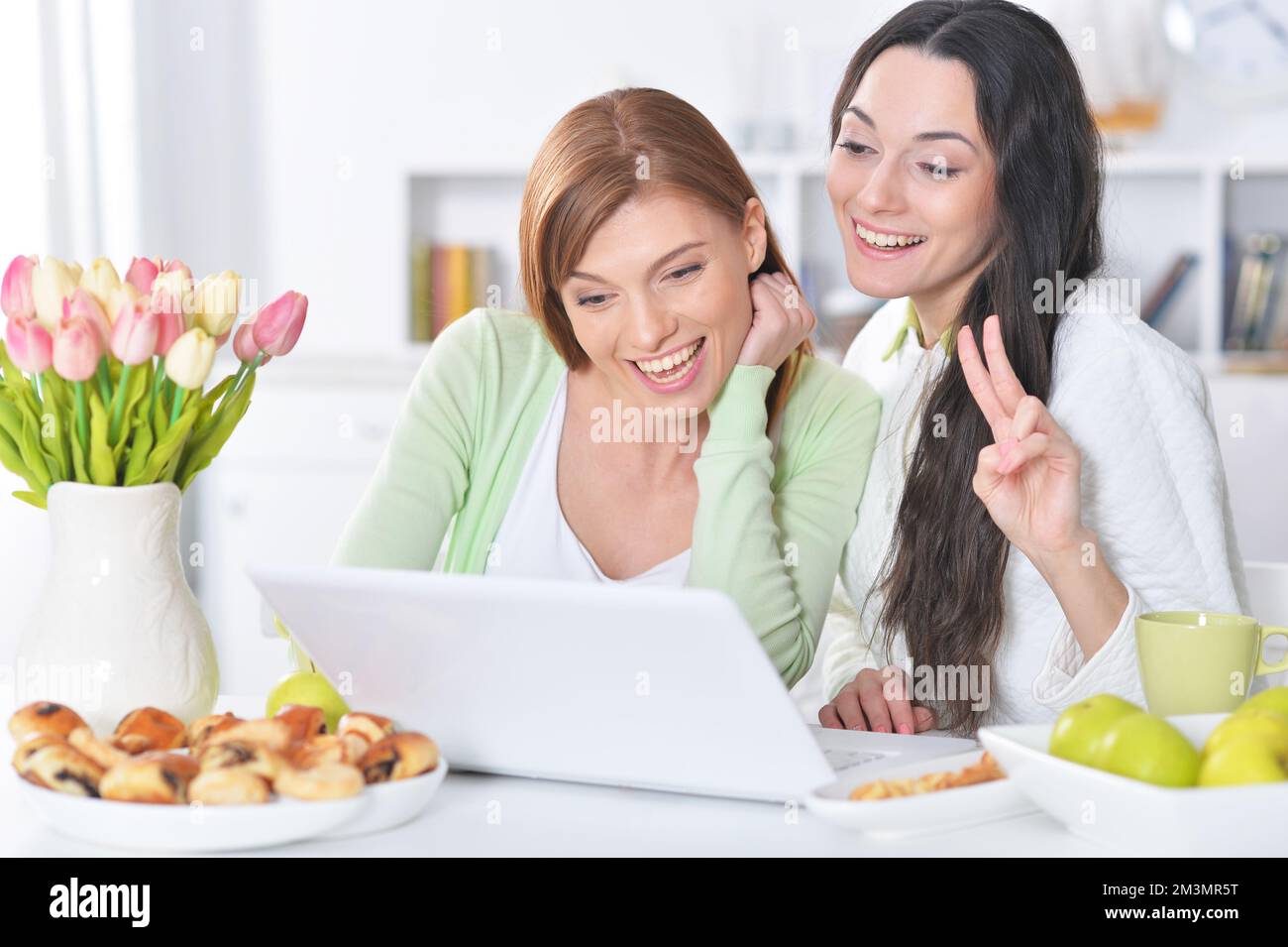 two female friends at desk Stock Photo - Alamy