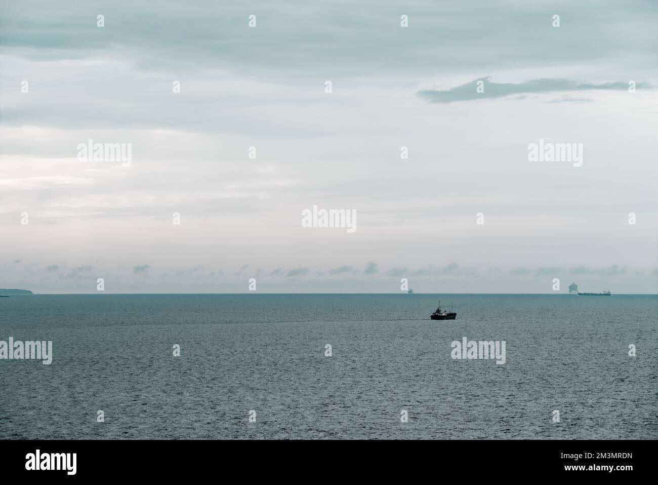 Panoramic view of sea and single ship against horizon over water Stock ...
