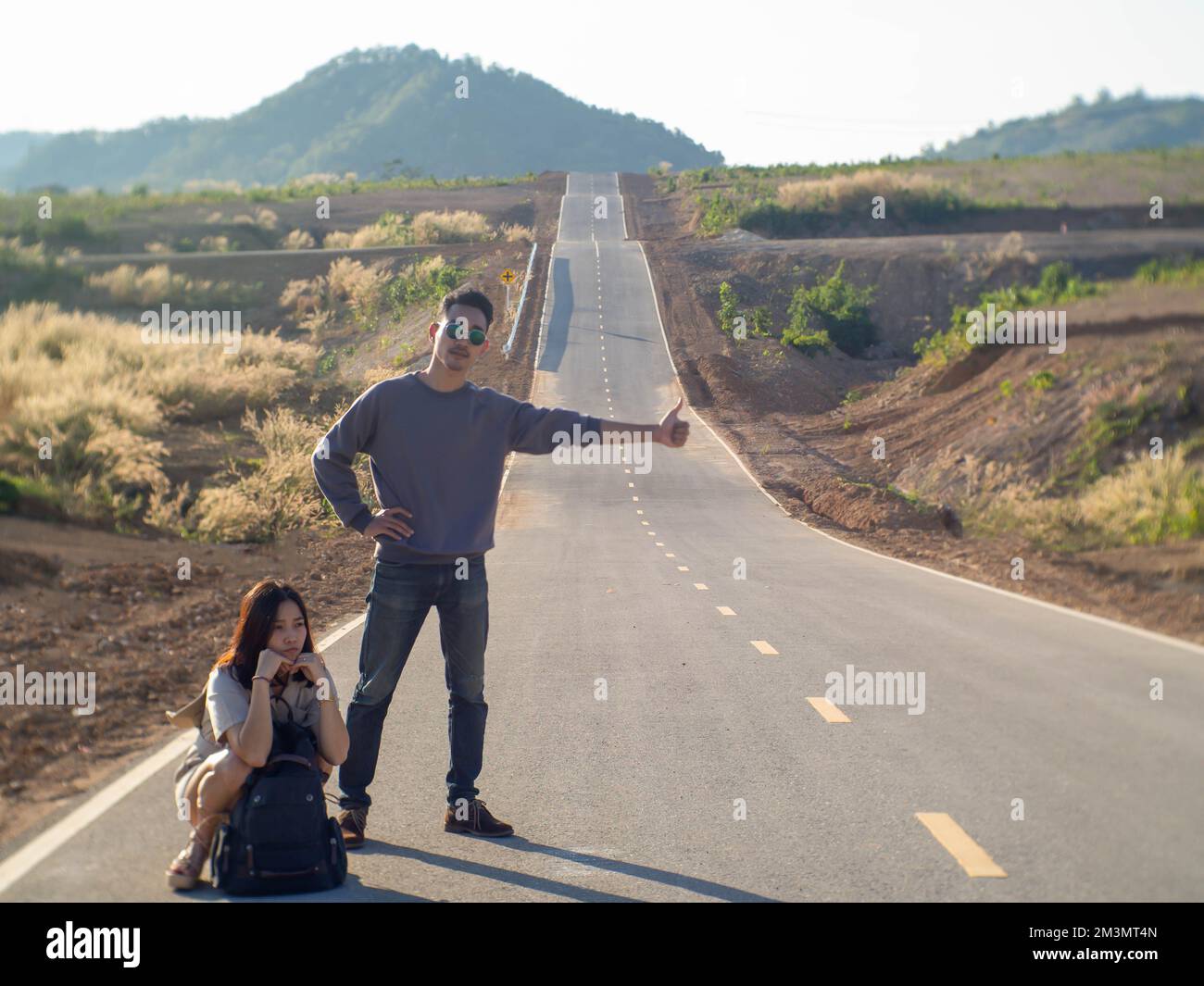 Hitchhiking lover hi-res stock photography and images - Alamy