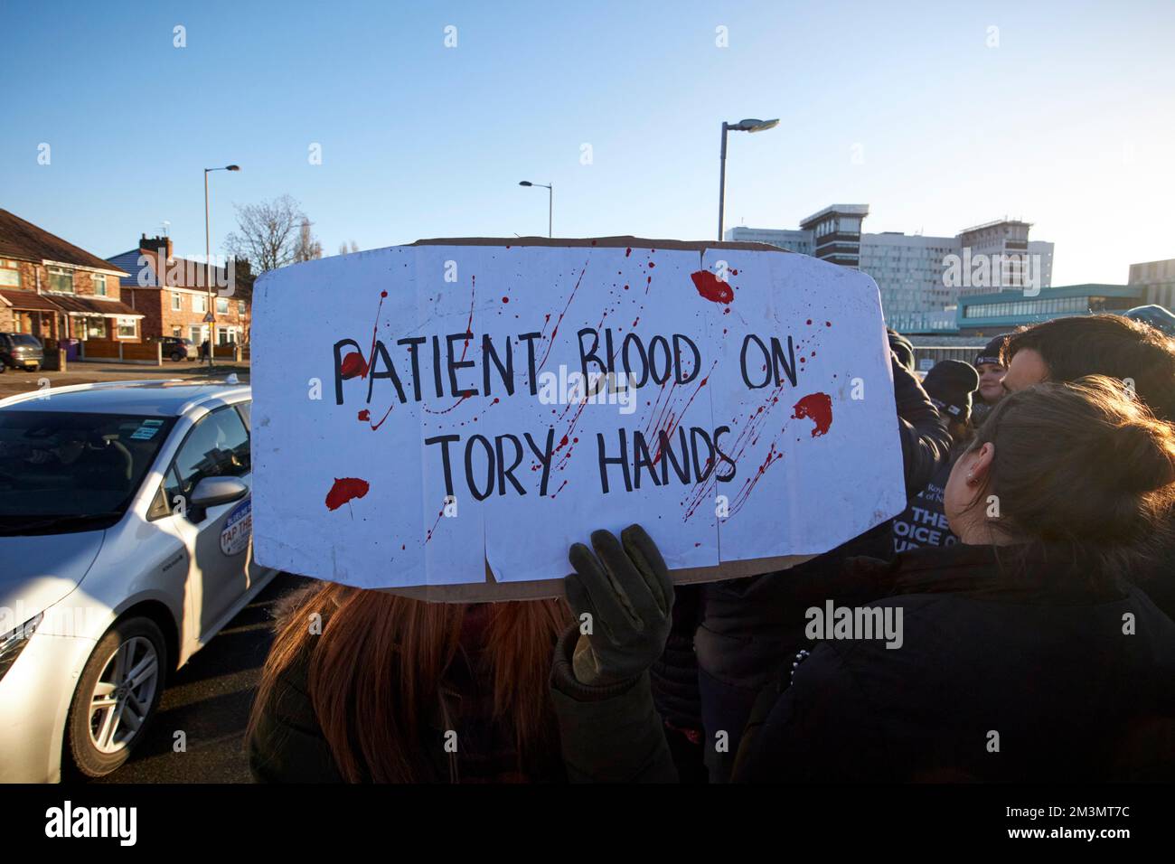handwritten anti tory placard held by nurse on the picket line during ...