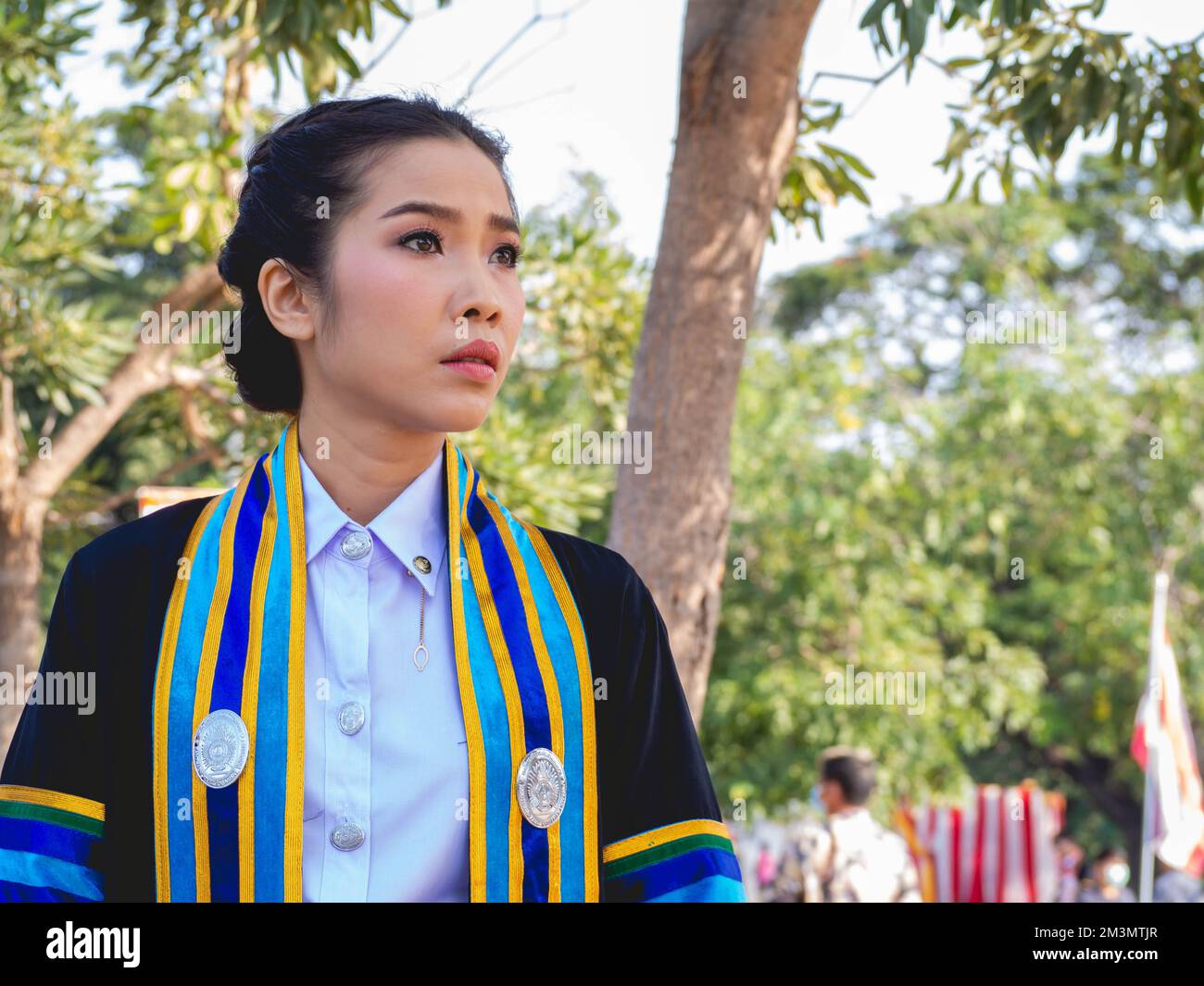 The graduate wore a gown from a university in Thailand. For graduation ...