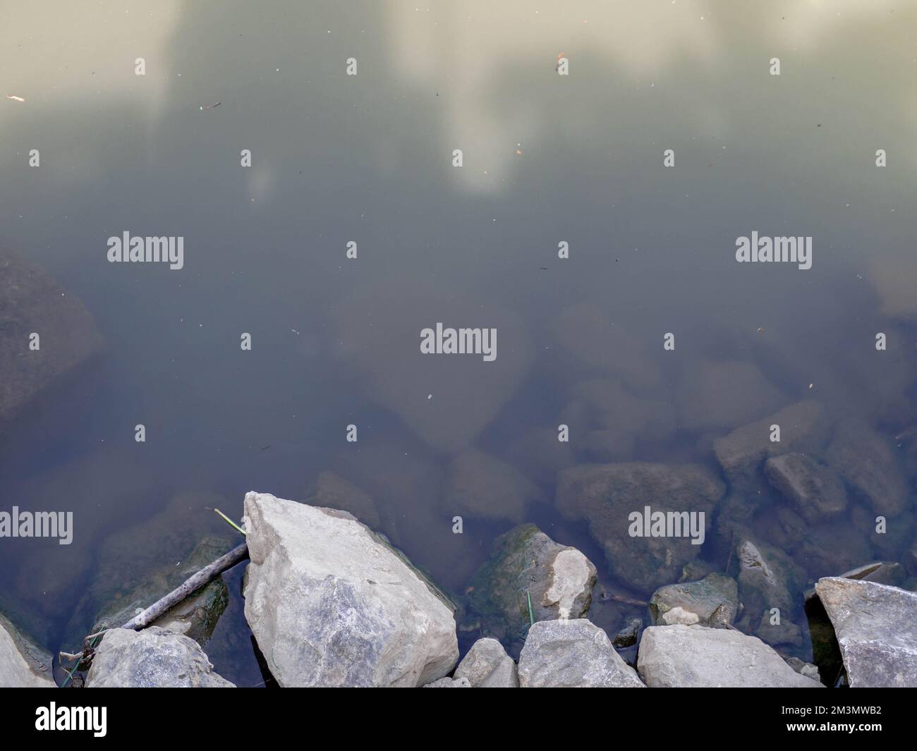 Stone background by the river Stock Photo - Alamy