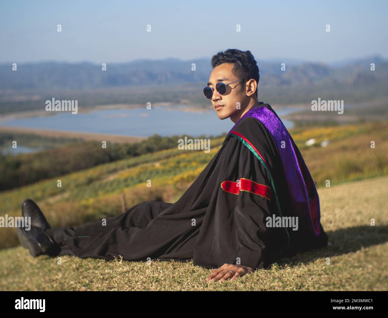 The graduate wore a gown from a university in Thailand. For graduation ...