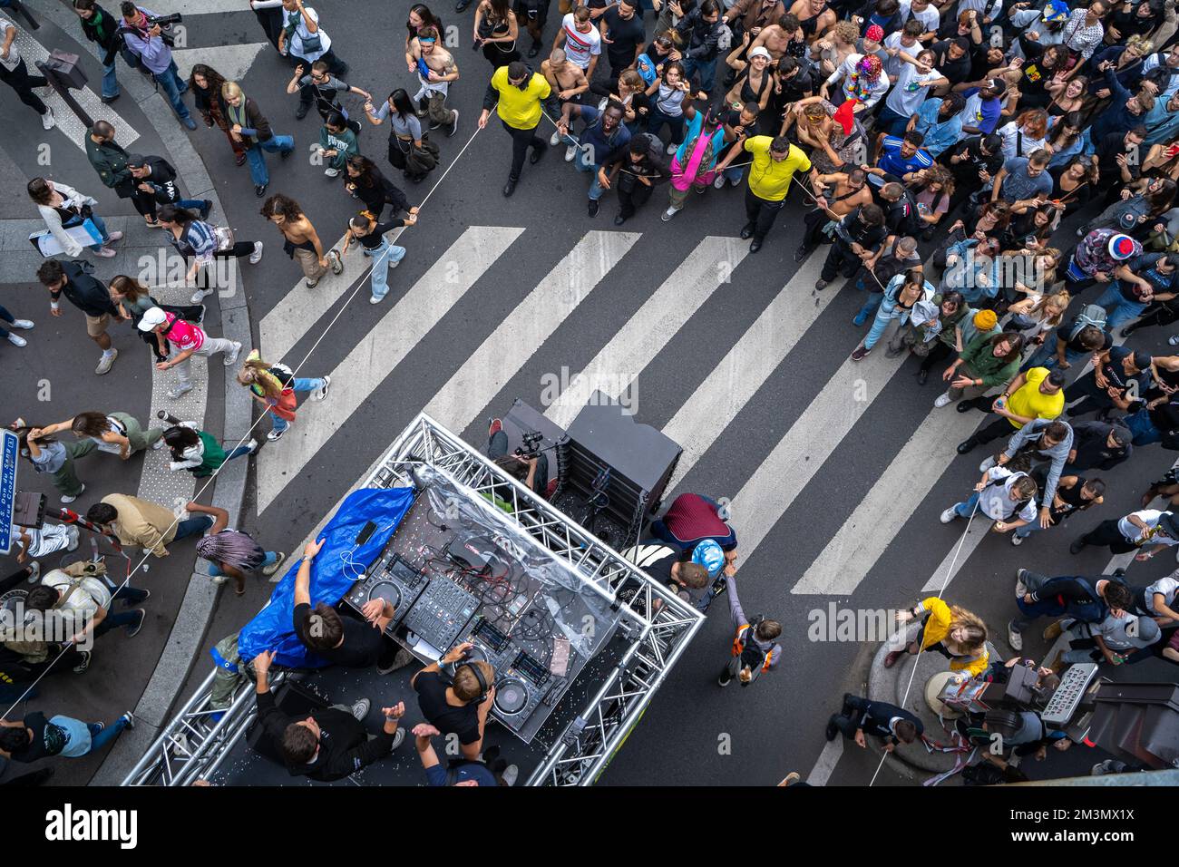 Crowd following a music truck during Paris Techno Parade 2022 Stock ...