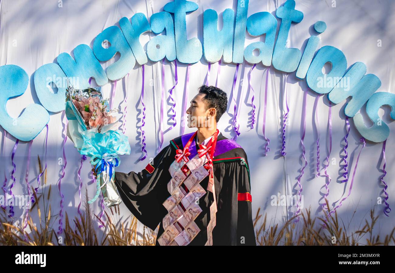 The graduate wore a gown from a university in Thailand. For graduation ...