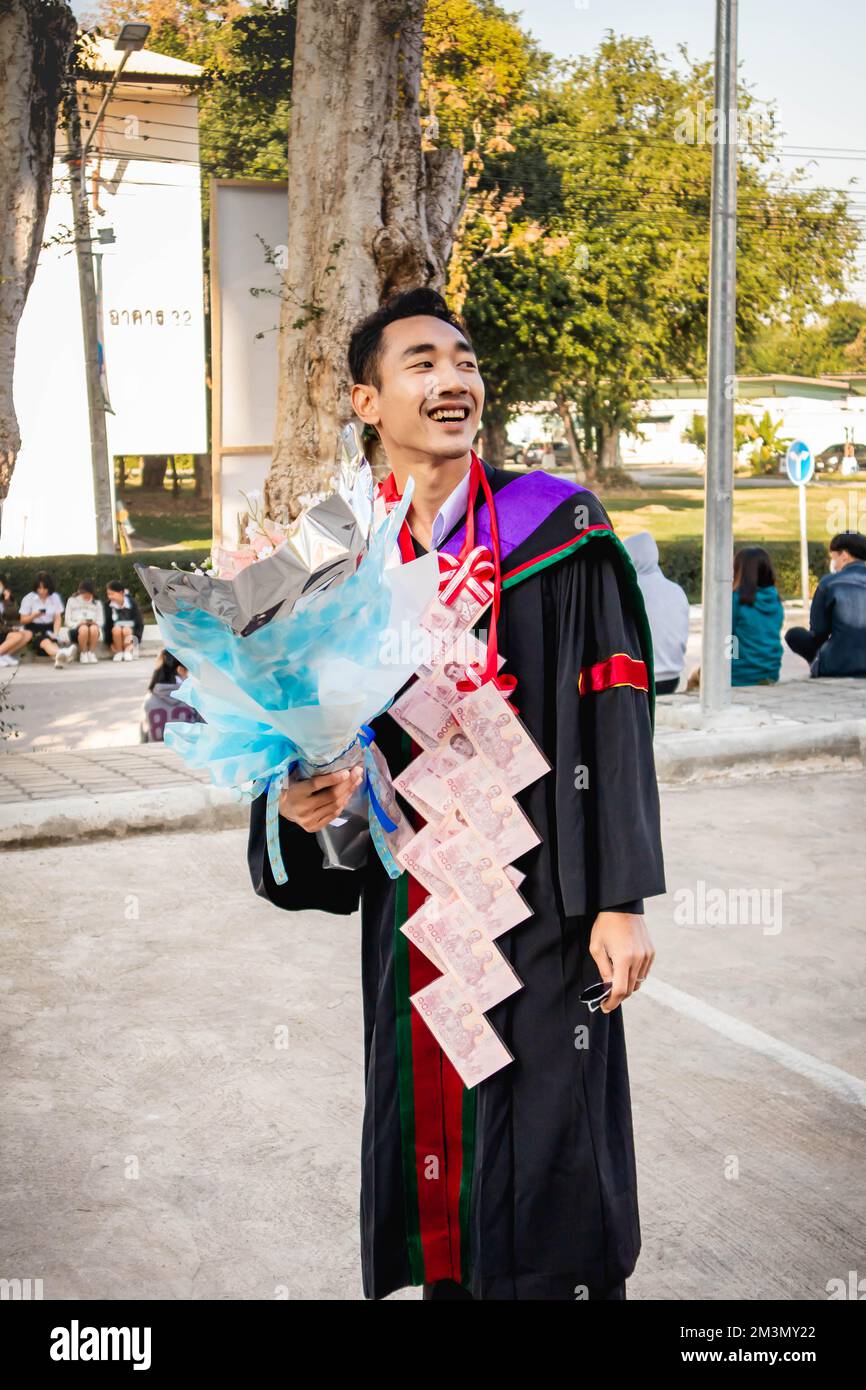 The graduate wore a gown from a university in Thailand. For graduation ...