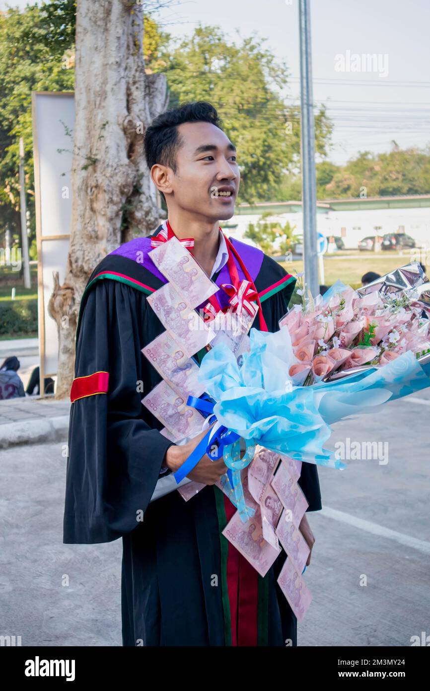The graduate wore a gown from a university in Thailand. For graduation ...