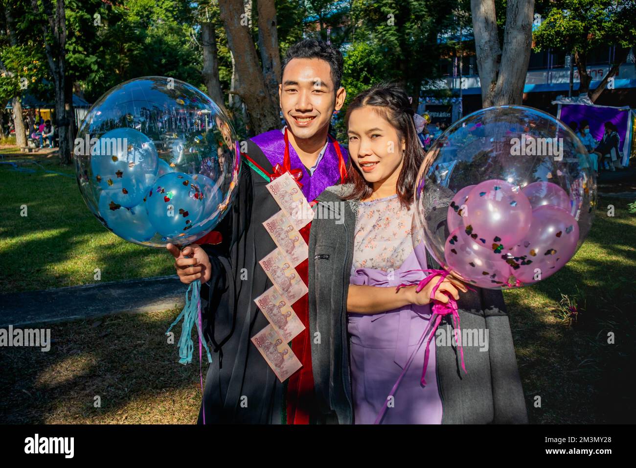 The graduate wore a gown from a university in Thailand. For graduation ...