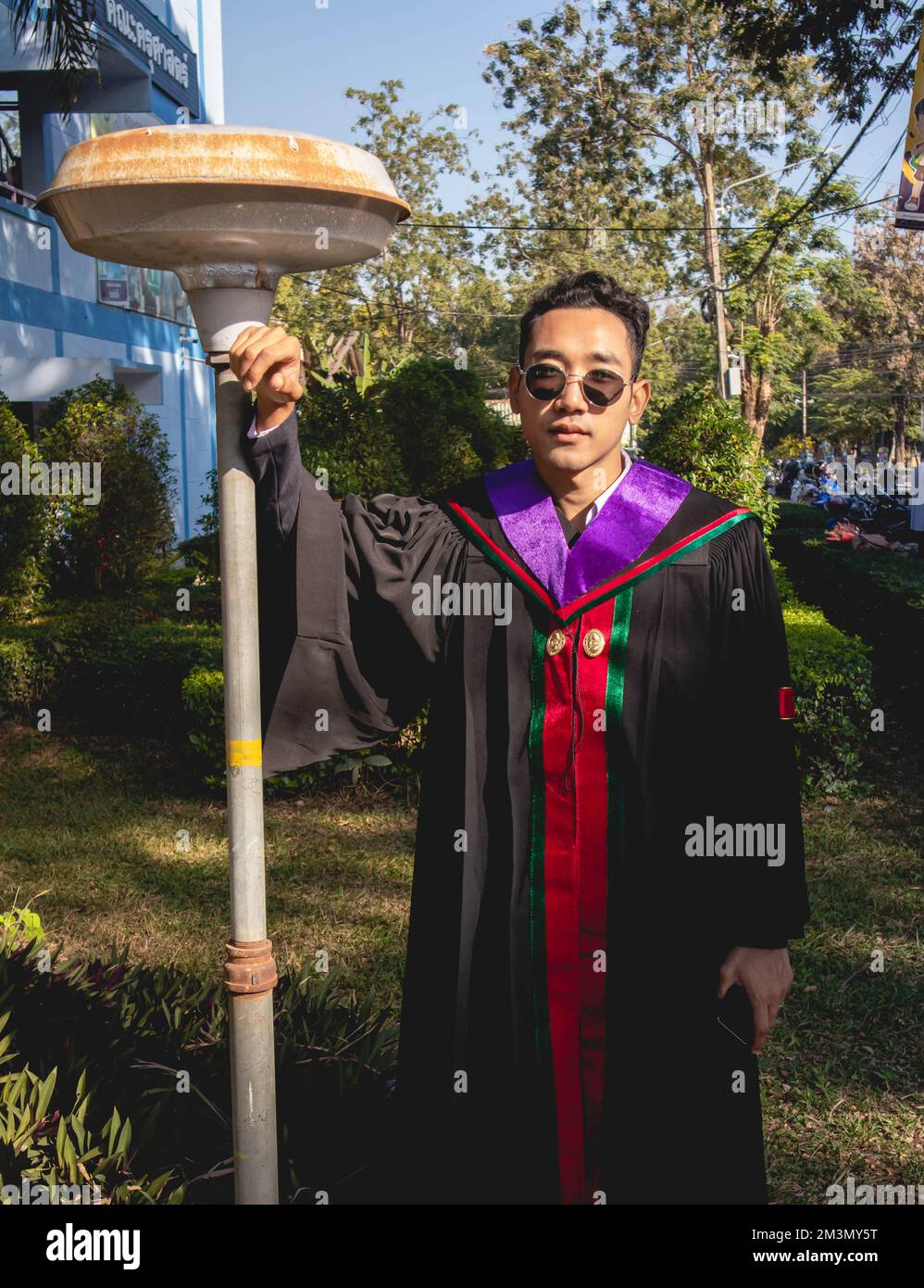 The graduate wore a gown from a university in Thailand. For graduation ...