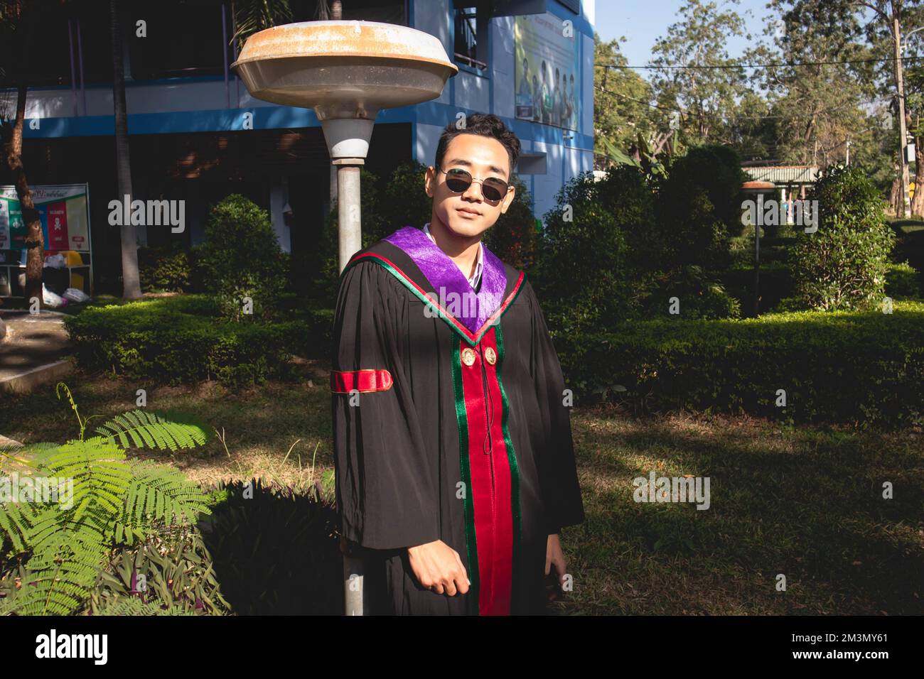 The graduate wore a gown from a university in Thailand. For graduation ...