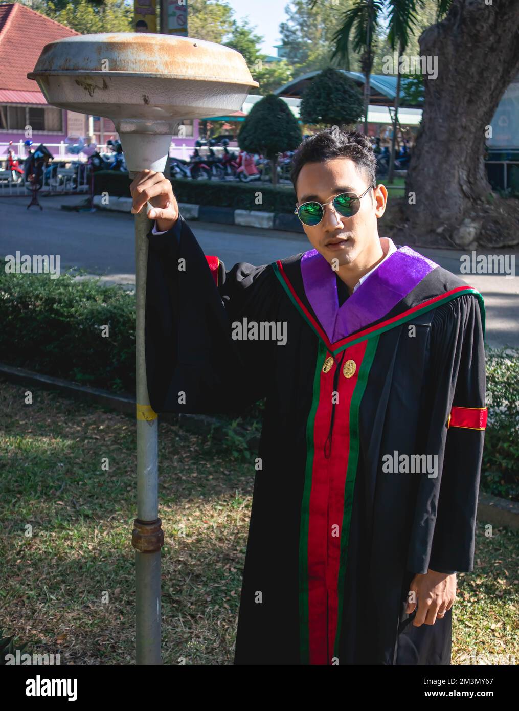 The graduate wore a gown from a university in Thailand. For graduation ...