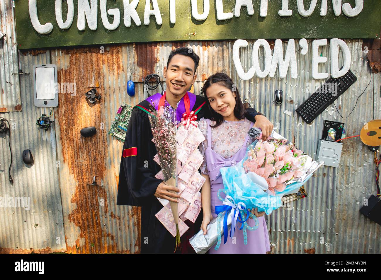 The graduate wore a gown from a university in Thailand. For graduation ...