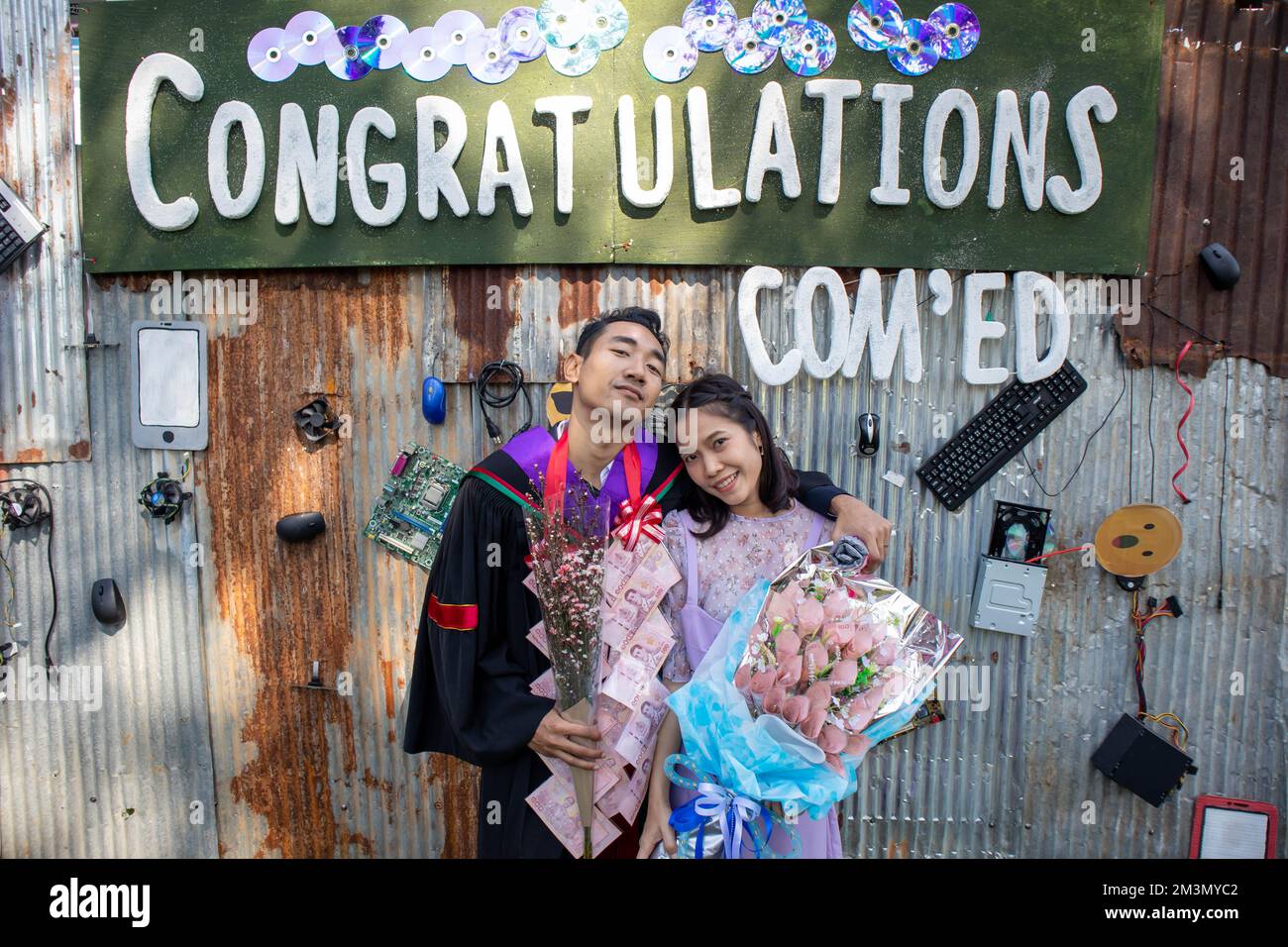 The graduate wore a gown from a university in Thailand. For graduation ...