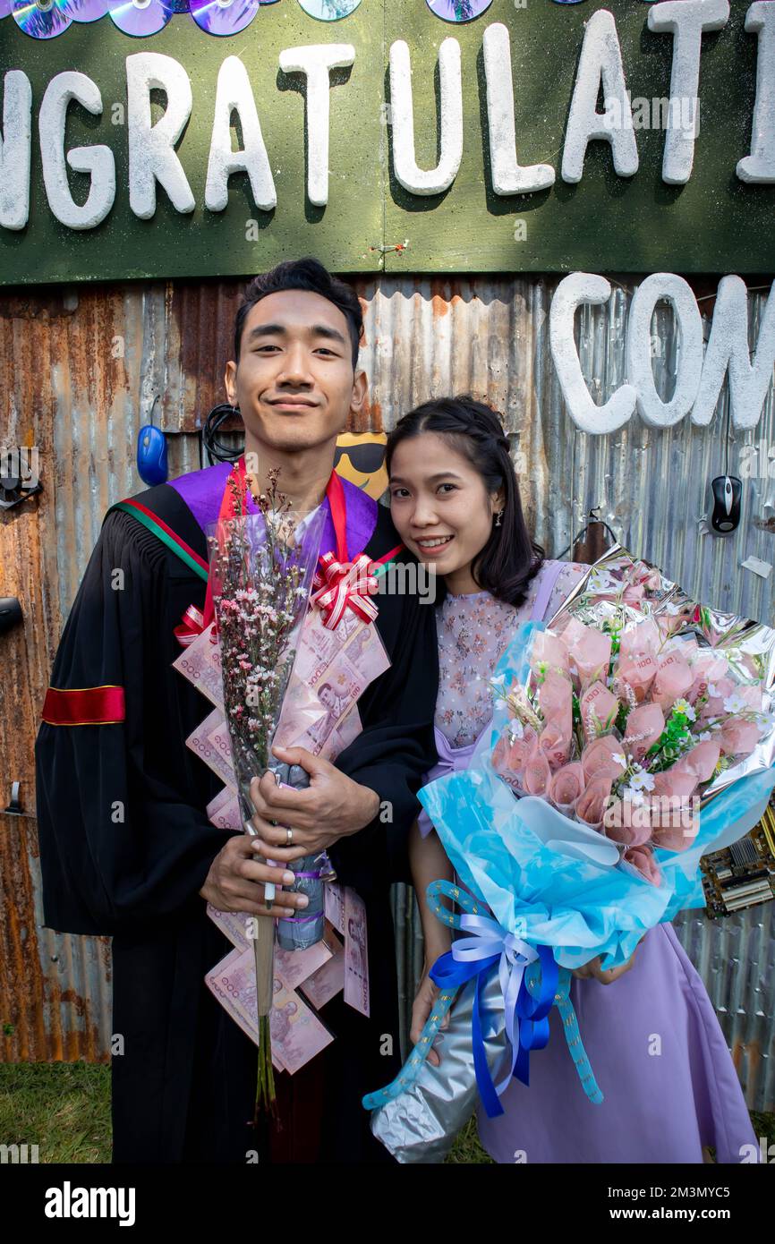 The graduate wore a gown from a university in Thailand. For graduation ...