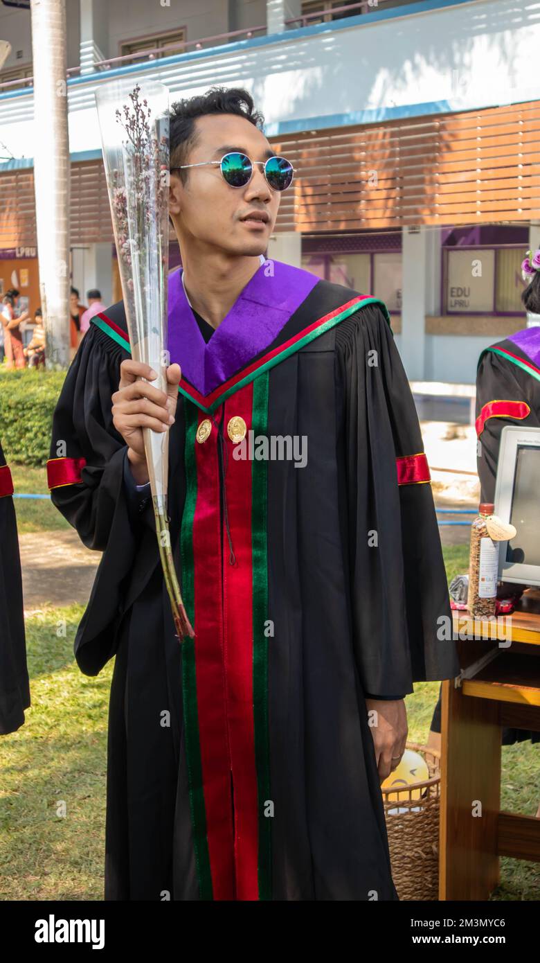 The graduate wore a gown from a university in Thailand. For graduation ...