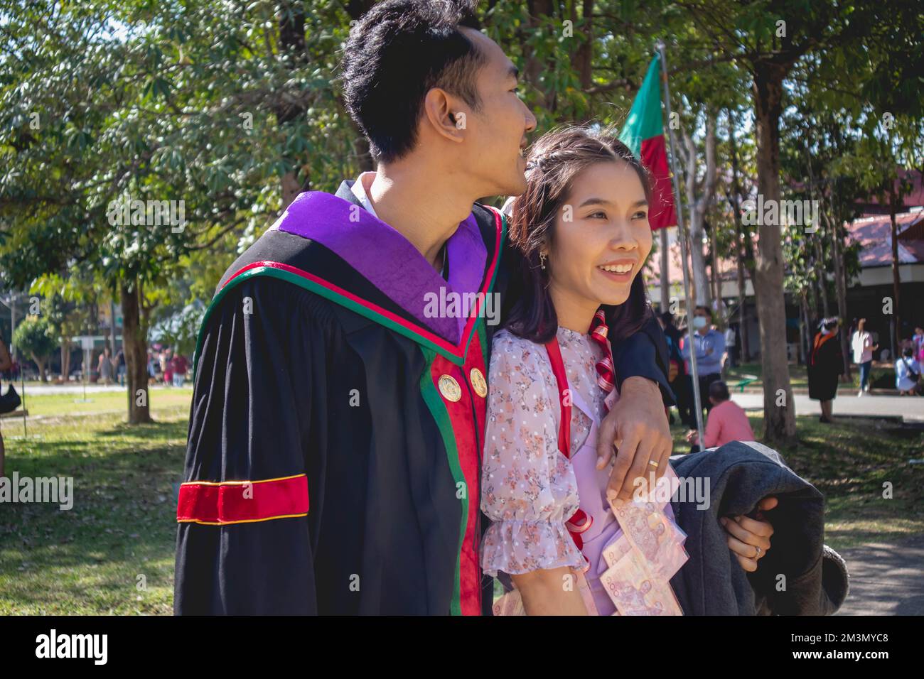 The graduate wore a gown from a university in Thailand. For graduation ...