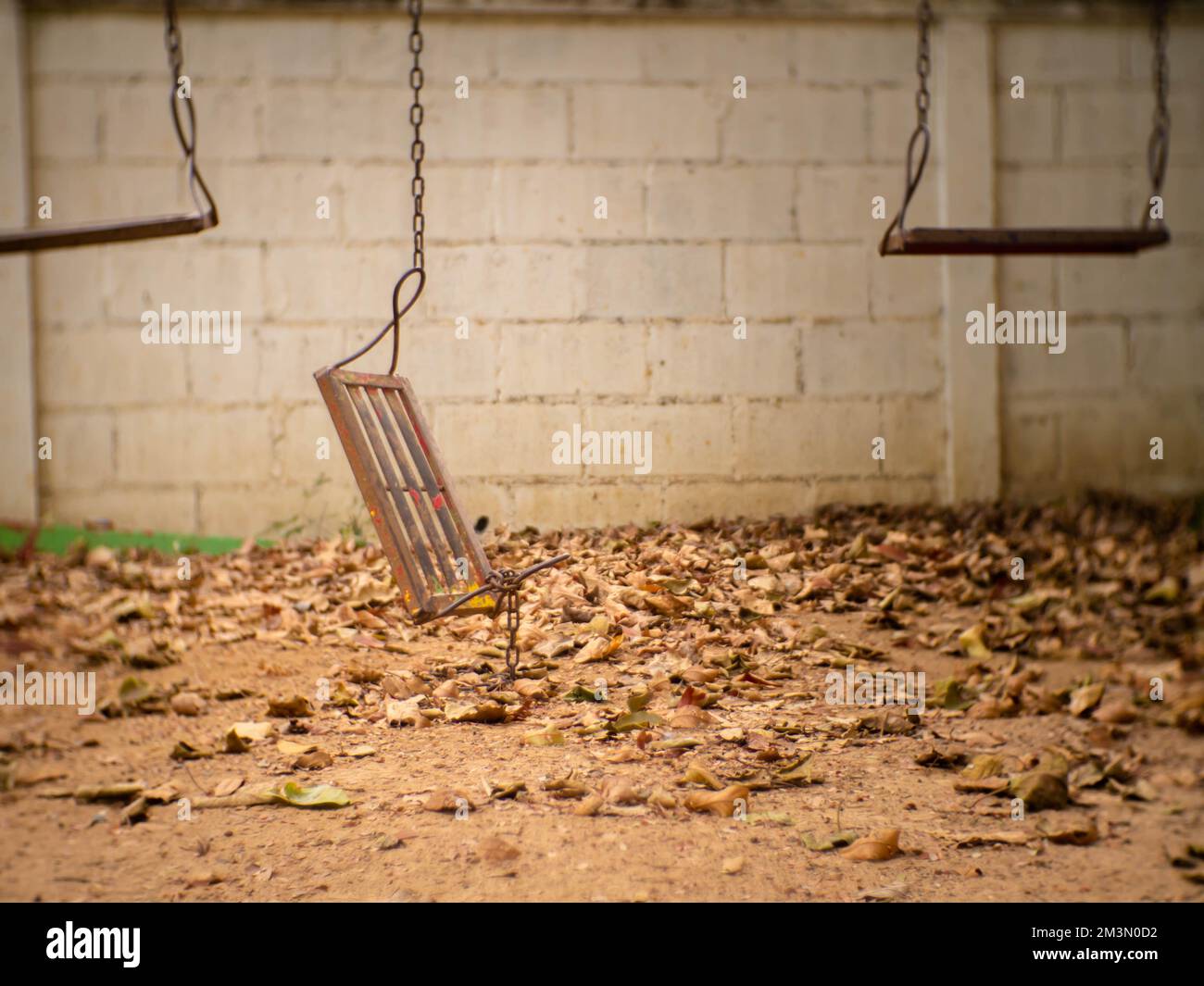 One side of the broken iron swing Stock Photo - Alamy