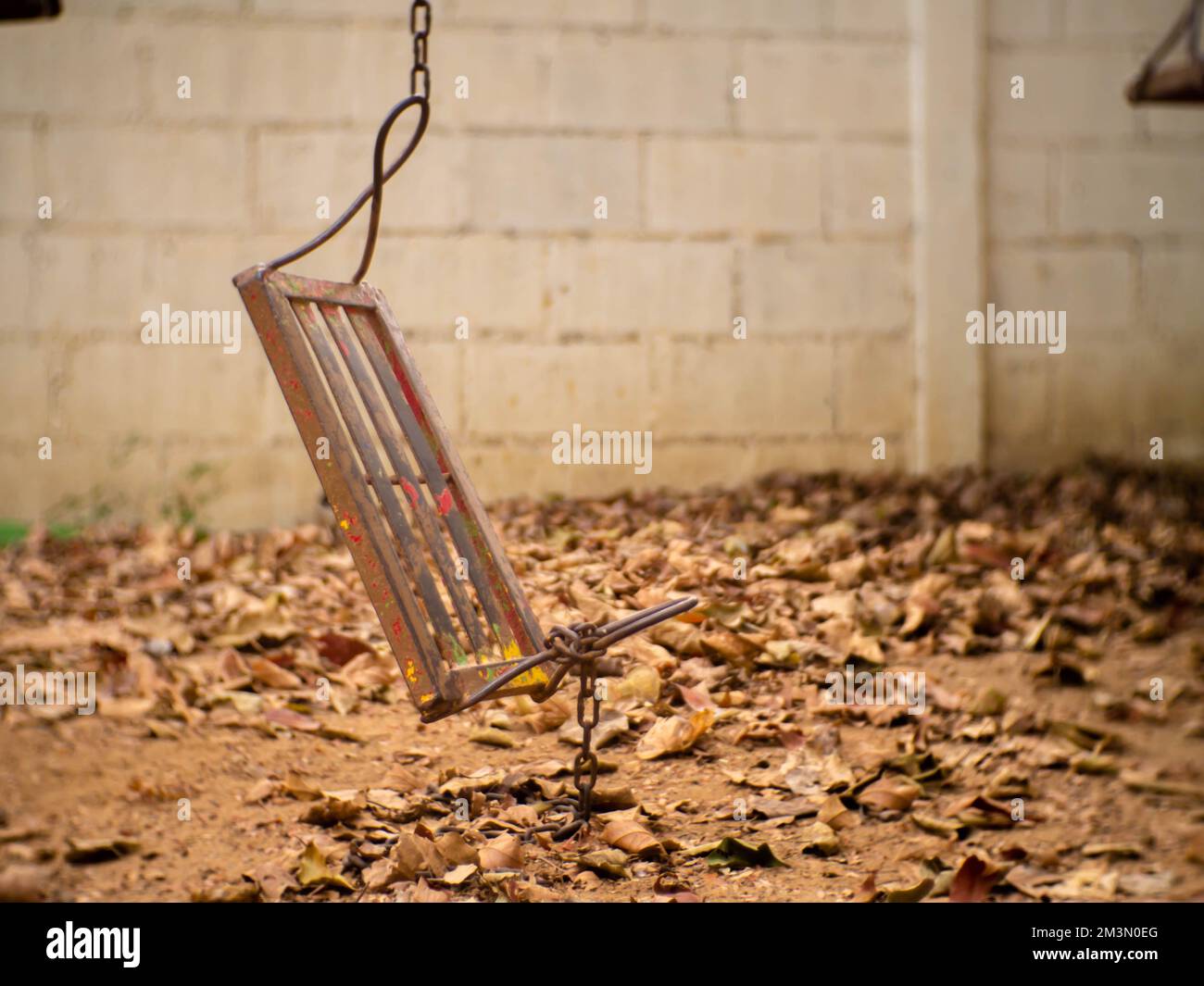 One side of the broken iron swing Stock Photo - Alamy