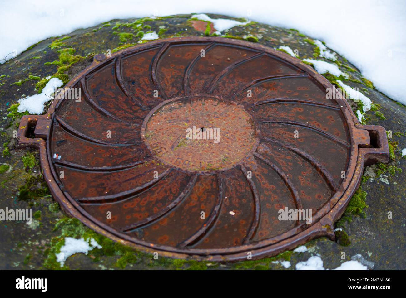 The manhole closes the city's sewage. Winter. Photo Stock Photo - Alamy