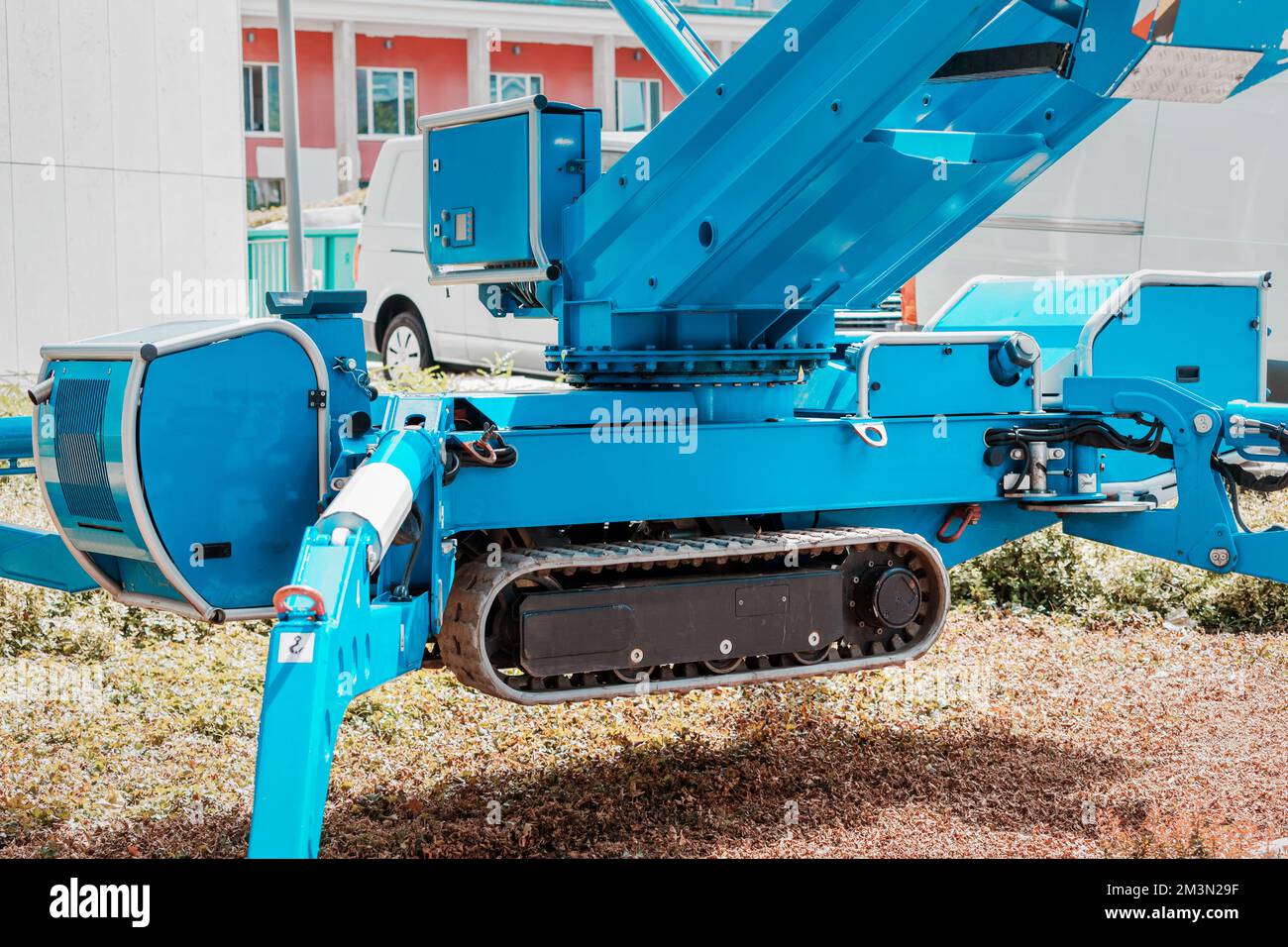 Industrial telescopic unmanned crane standing on hydraulic support legs ...