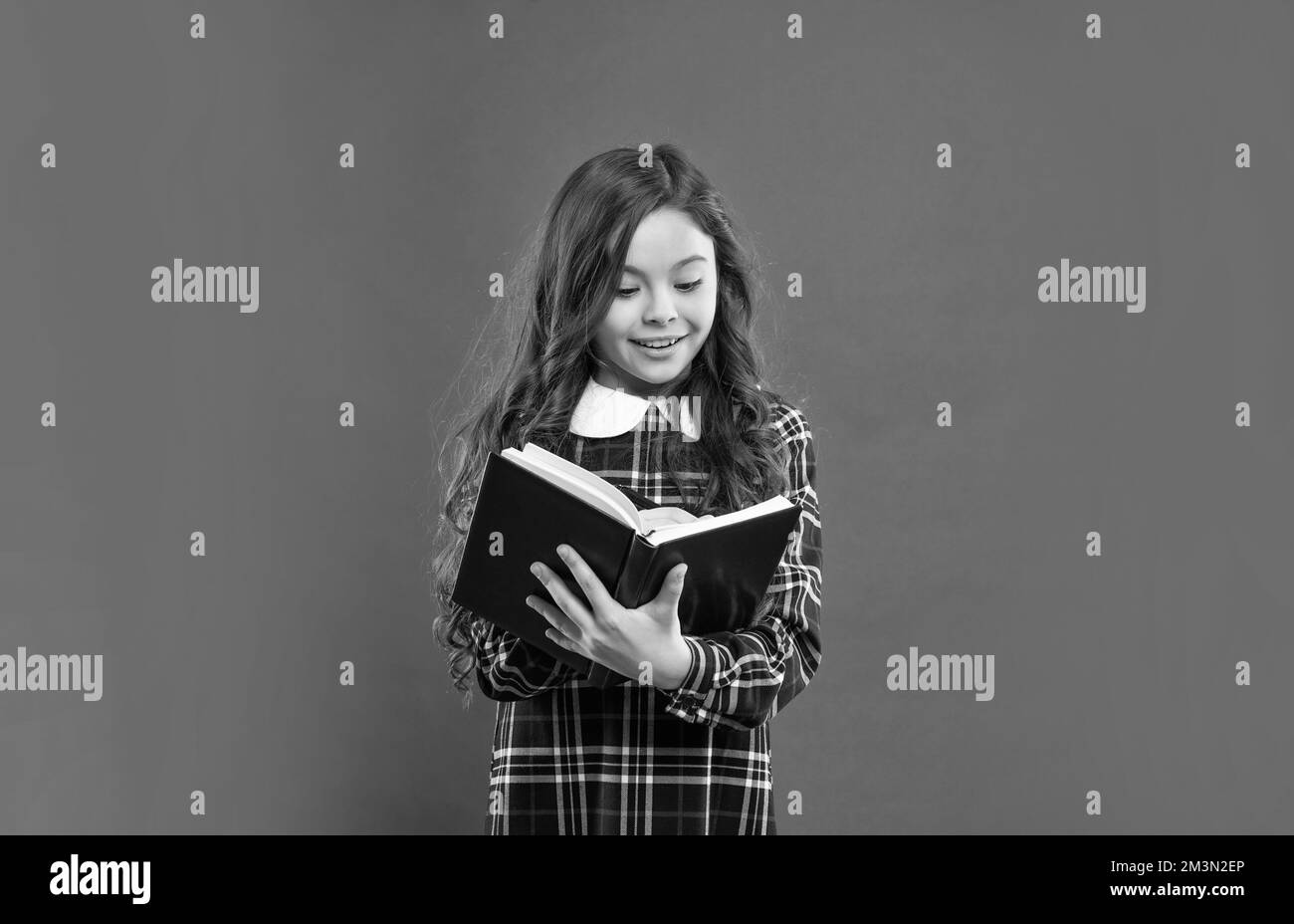 positive pupil or student making notes in notebook. teen girl study ...