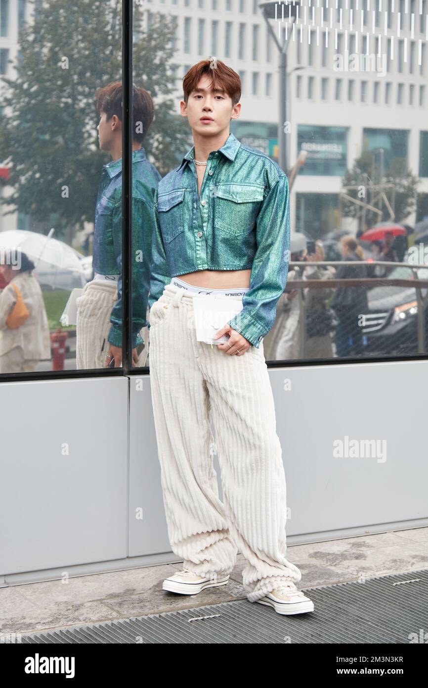 MILAN, ITALY - SEPTEMBER 24, 2022: Man with turquoise metallic jacket ...