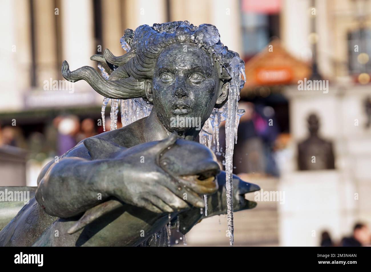 A frozen fountain in Trafalgar Square, central London. Snow and ice ...