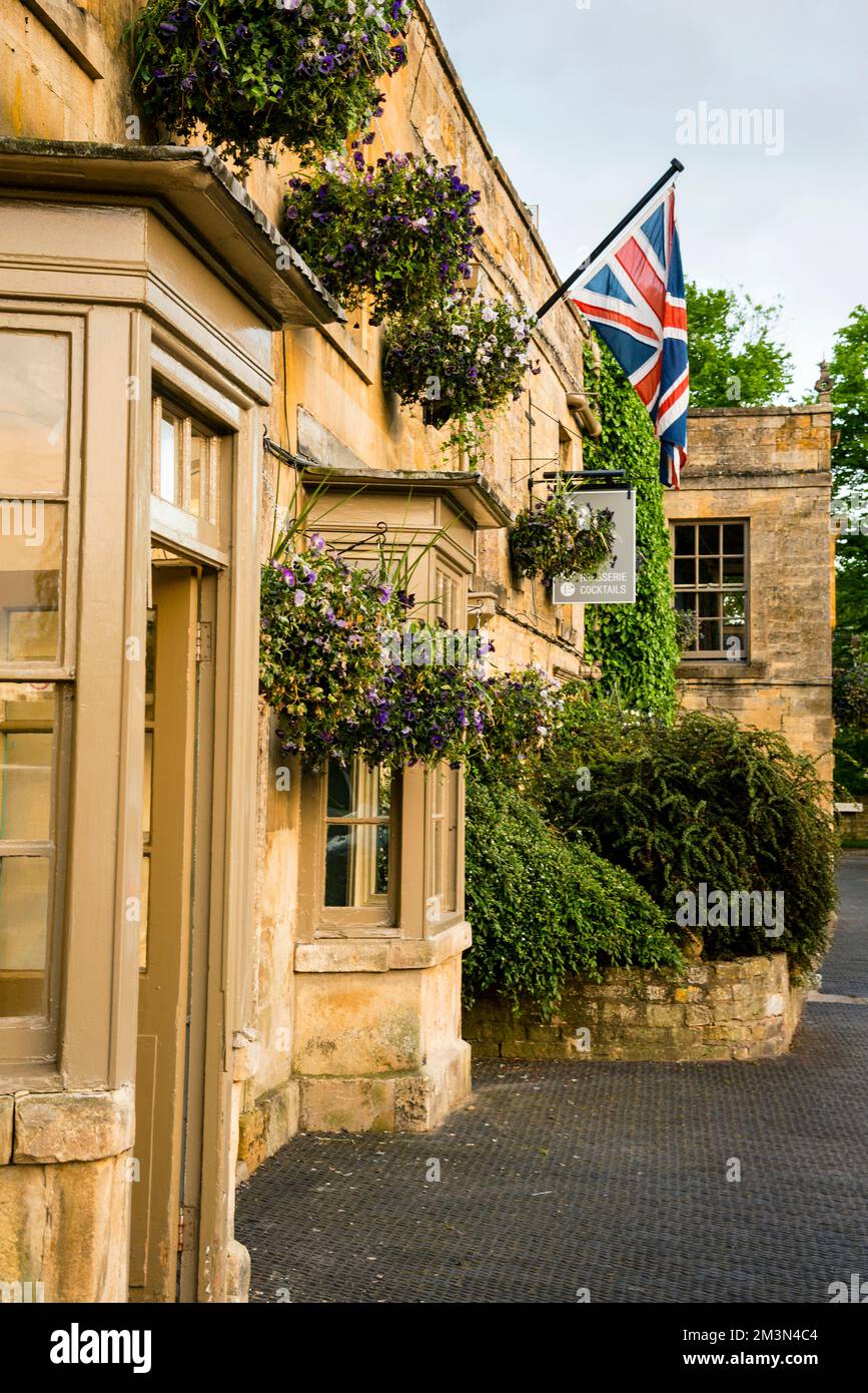 Box bay window or canted window of Cotswold stone in the market town of ...