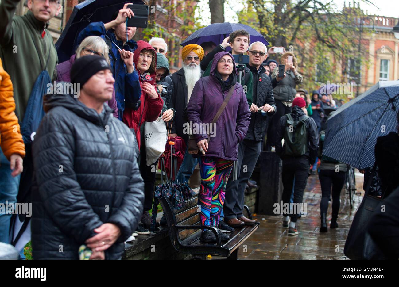 Expectant crowds line the streets in the rain outside York Minster ...