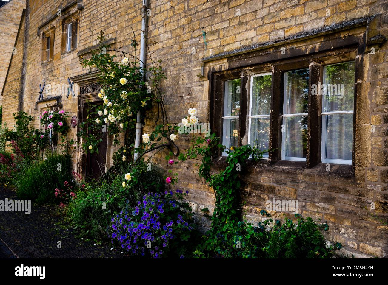 Moreton-in-Marsh Cotswold stone house with mullioned windows and carved ...