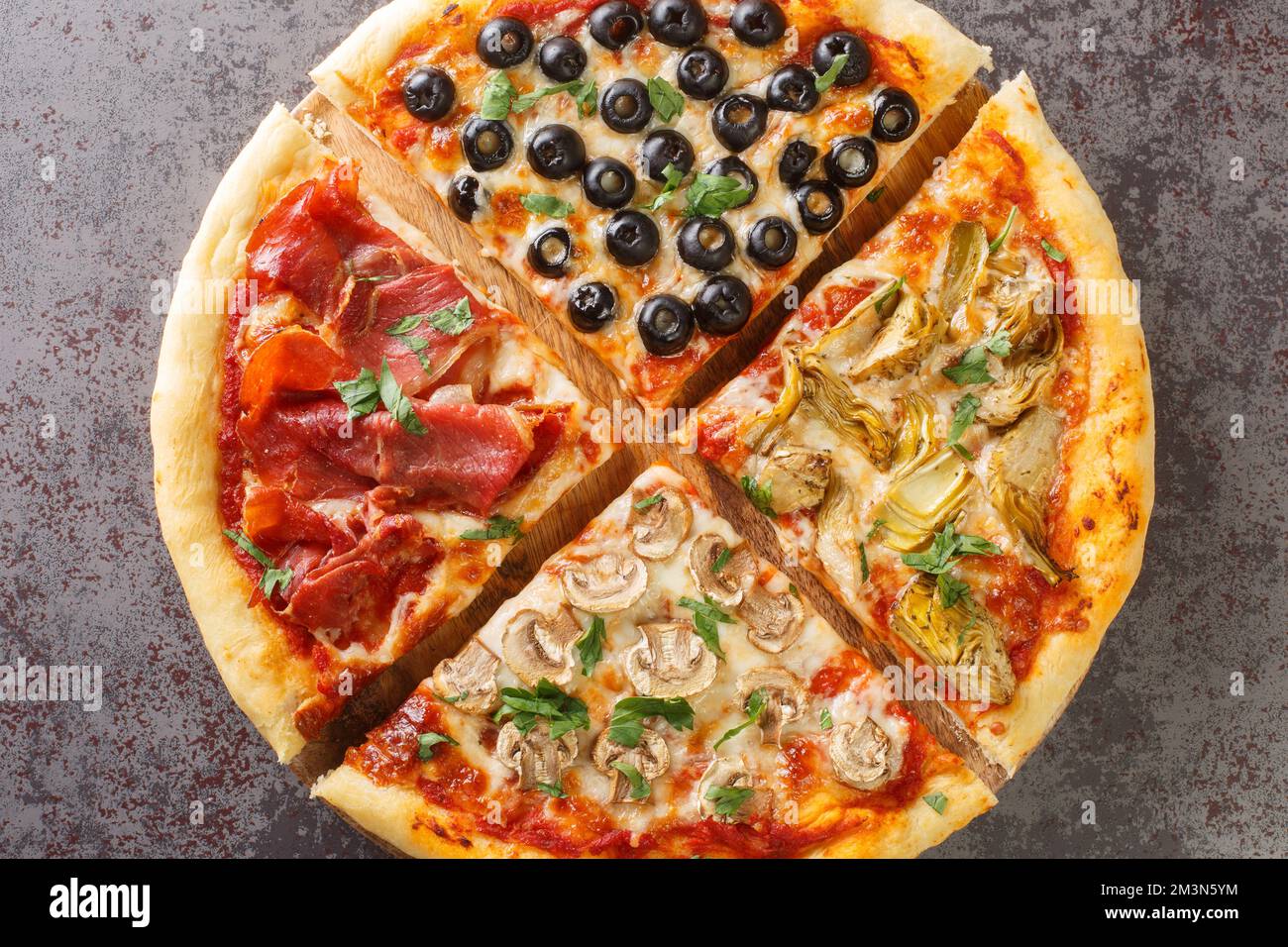 Pizza Four Seasons arranged into four sections, each representing a ...