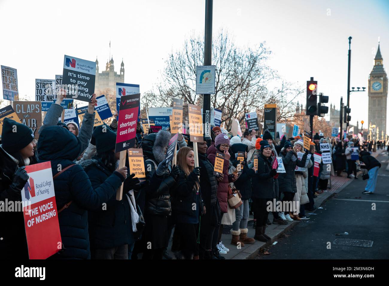 London, UK. 15th December, 2022. Nurses hold placards and signs at an ...