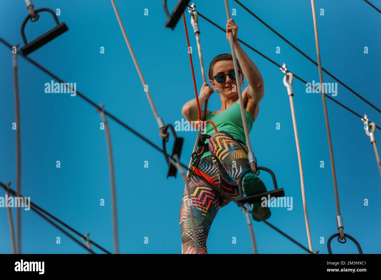 Skilled professional rock climber doing the hardest course in the ...