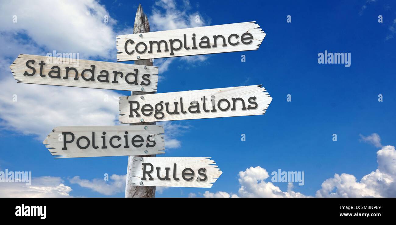 Compliance, standards, regulations, policies, rules - wooden signpost ...