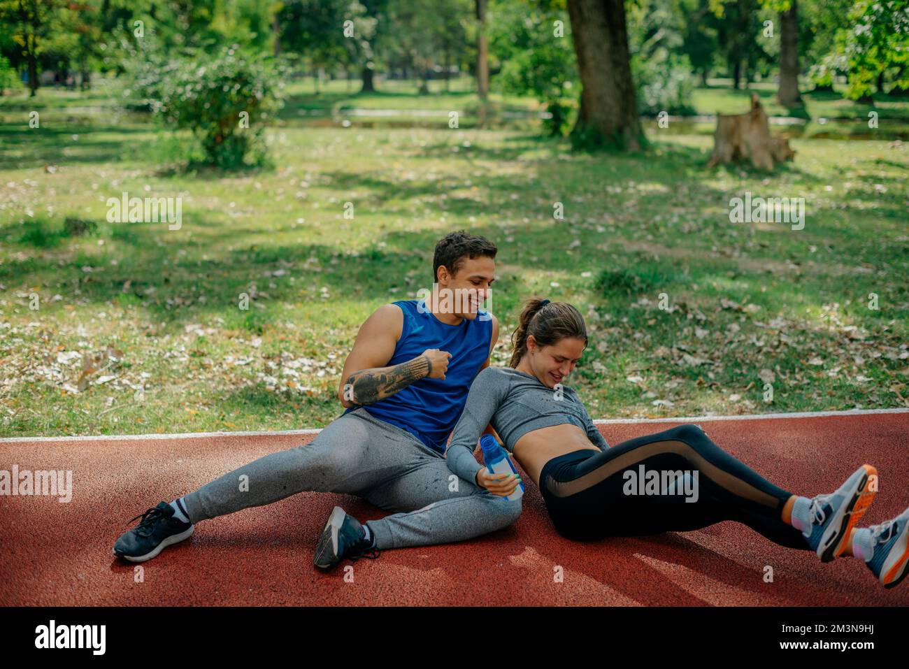 A good looking man is bothering his girlfriend while she was drinking ...