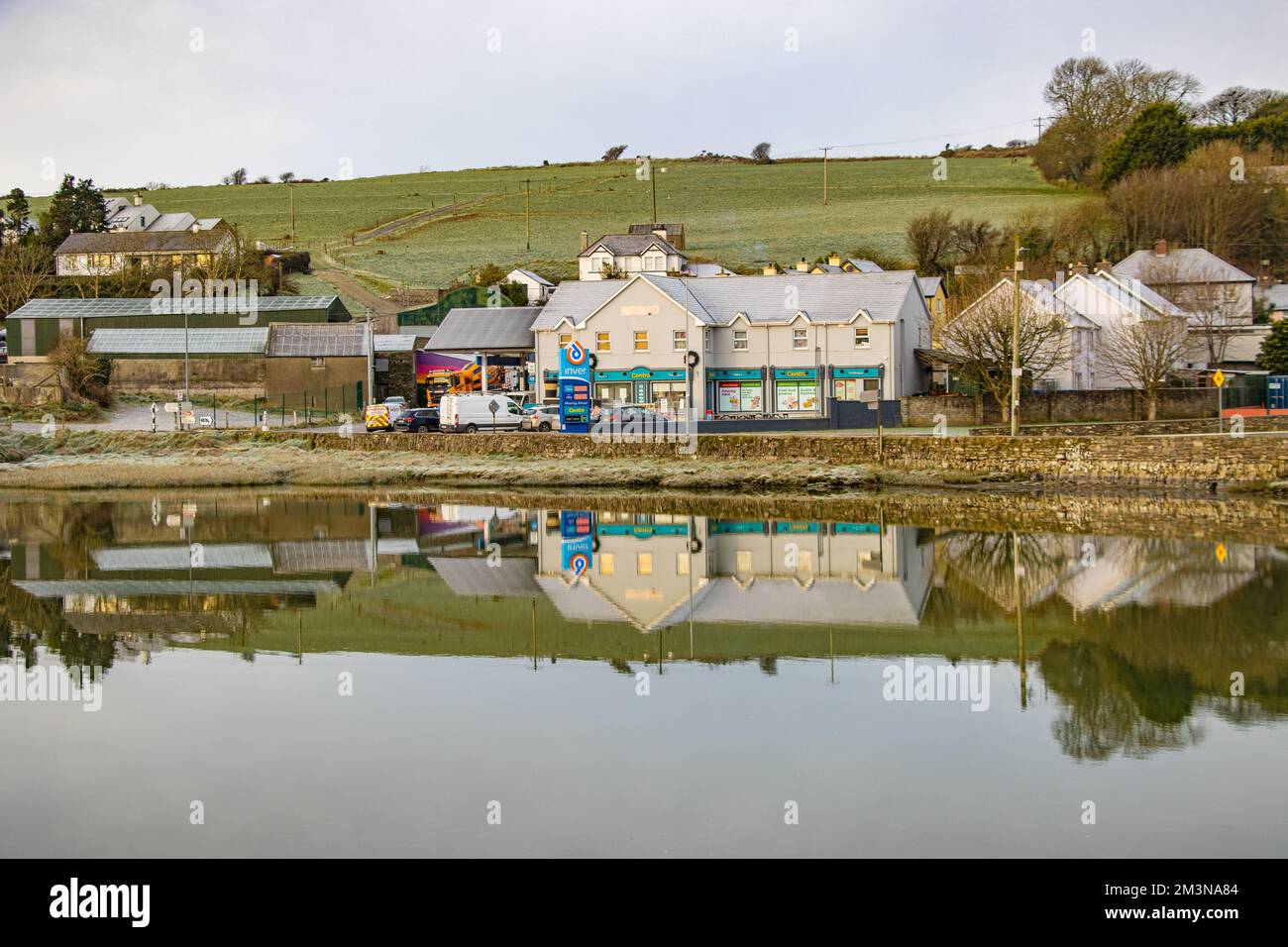 Foley's Centra, Timoleague, reflected in tidal estuary. Dec 2022 Stock ...