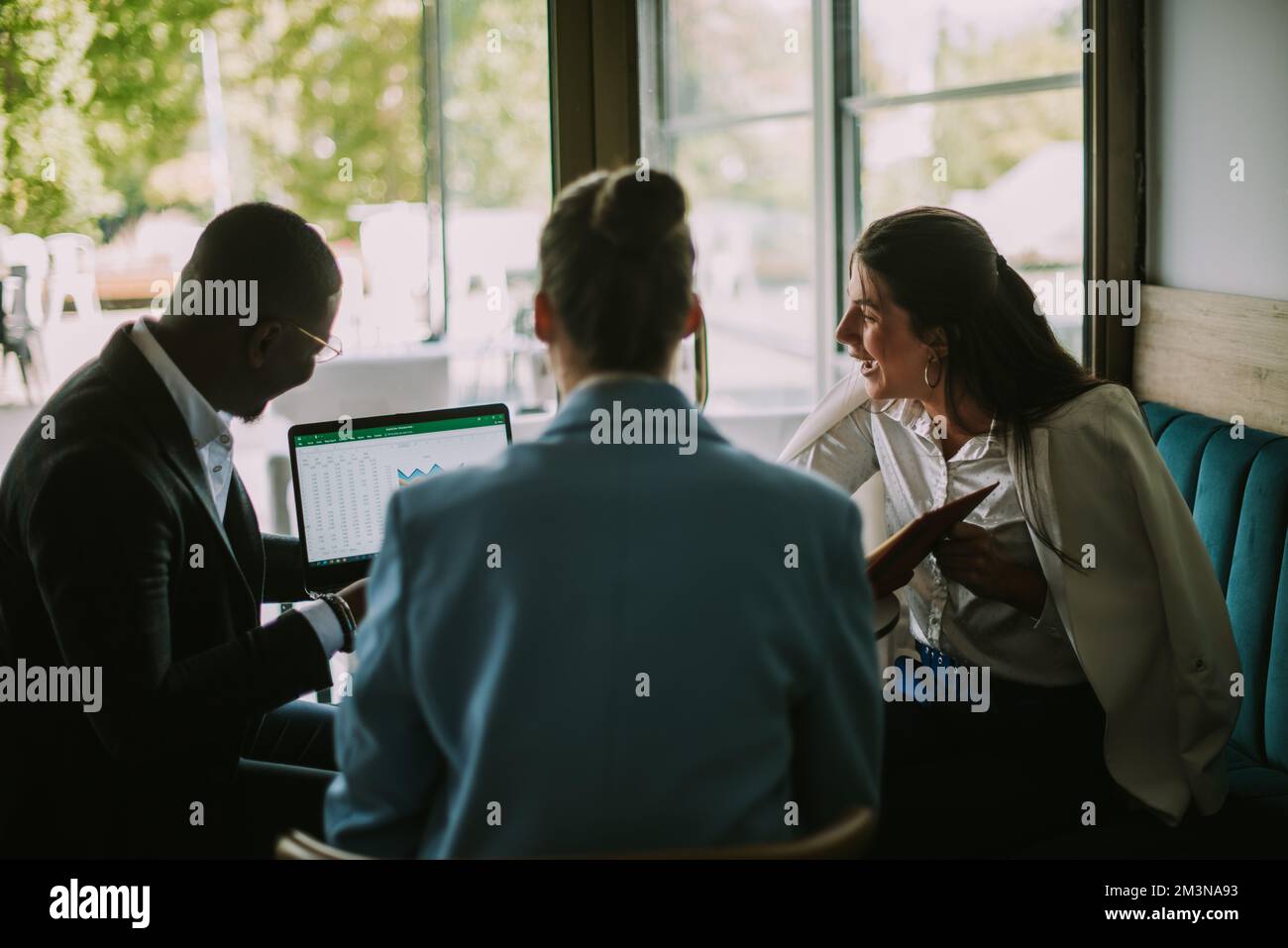 Three students conversating and discussing about their upcoming ...