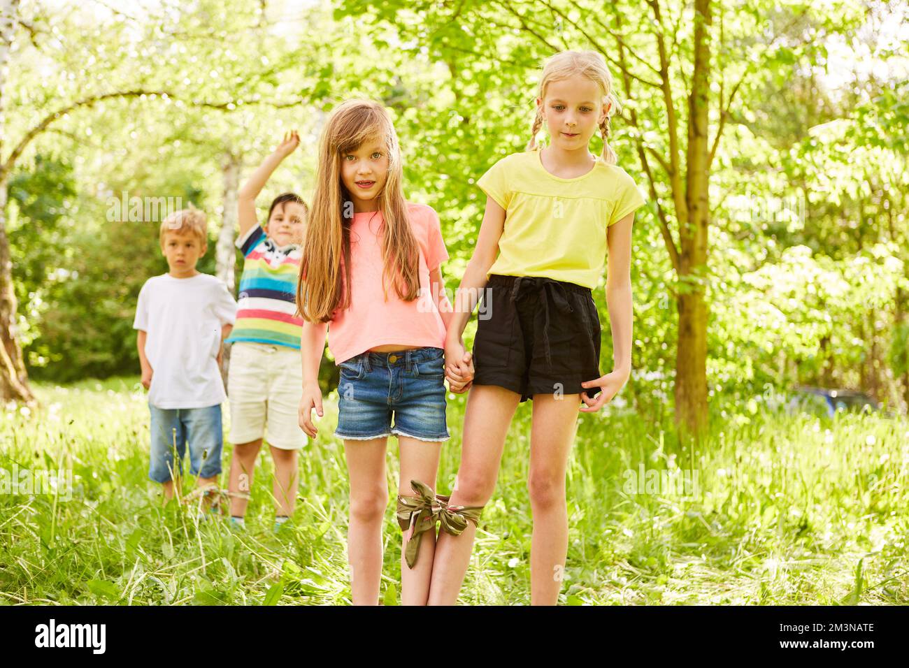 Childhood playing smiling enjoyment grass hi-res stock photography and ...
