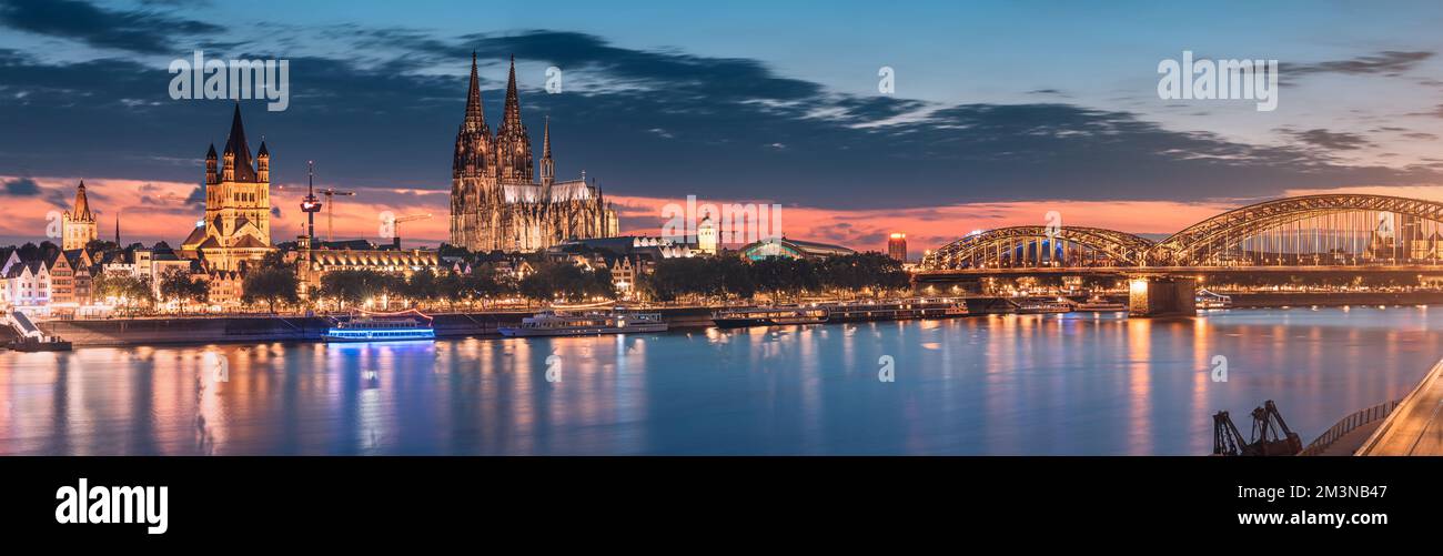 Cityscape night panoramic view of illuminated Cologne or Koln city with ...