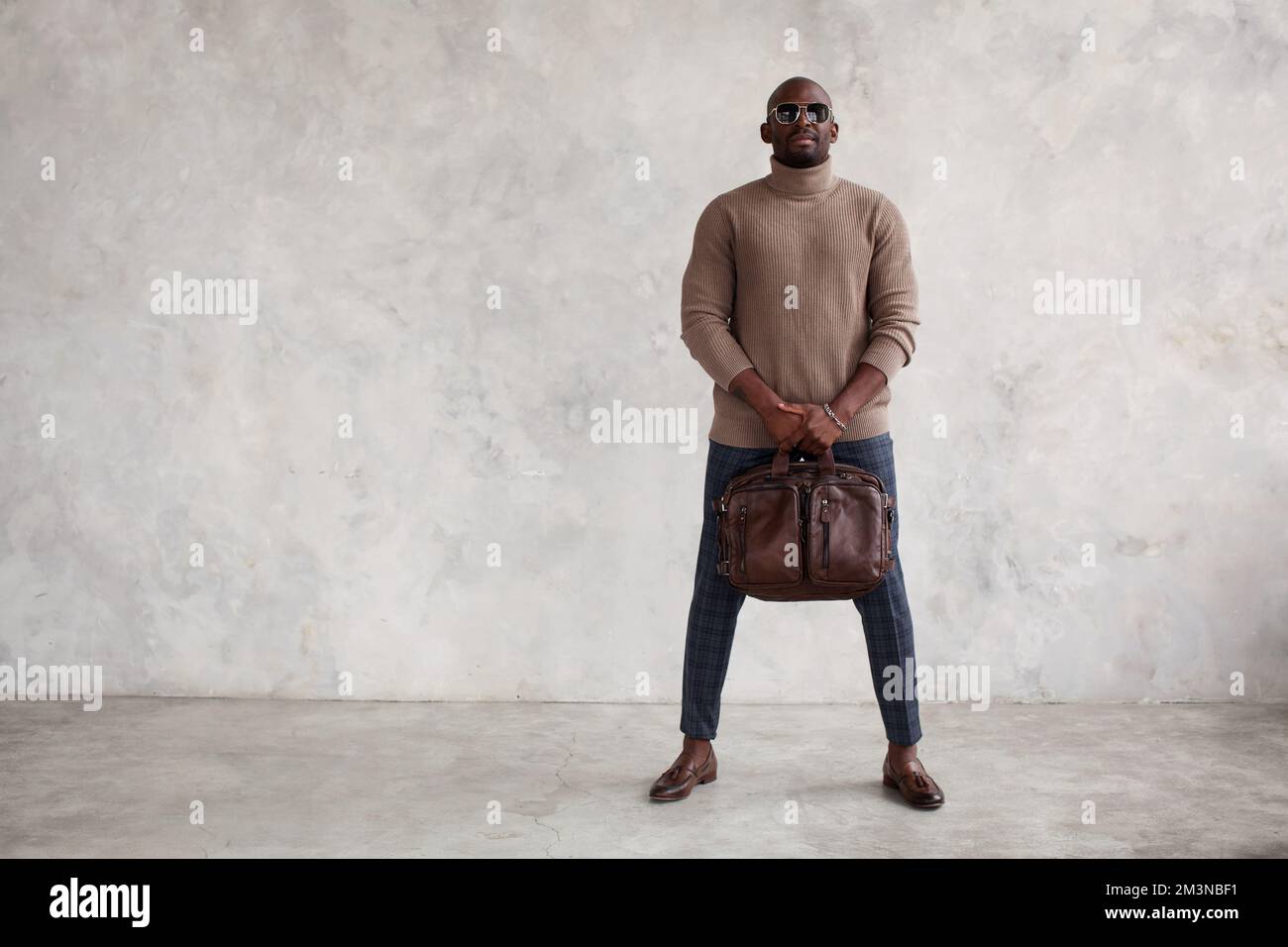 Stylish african american man stands hi-res stock photography and images ...